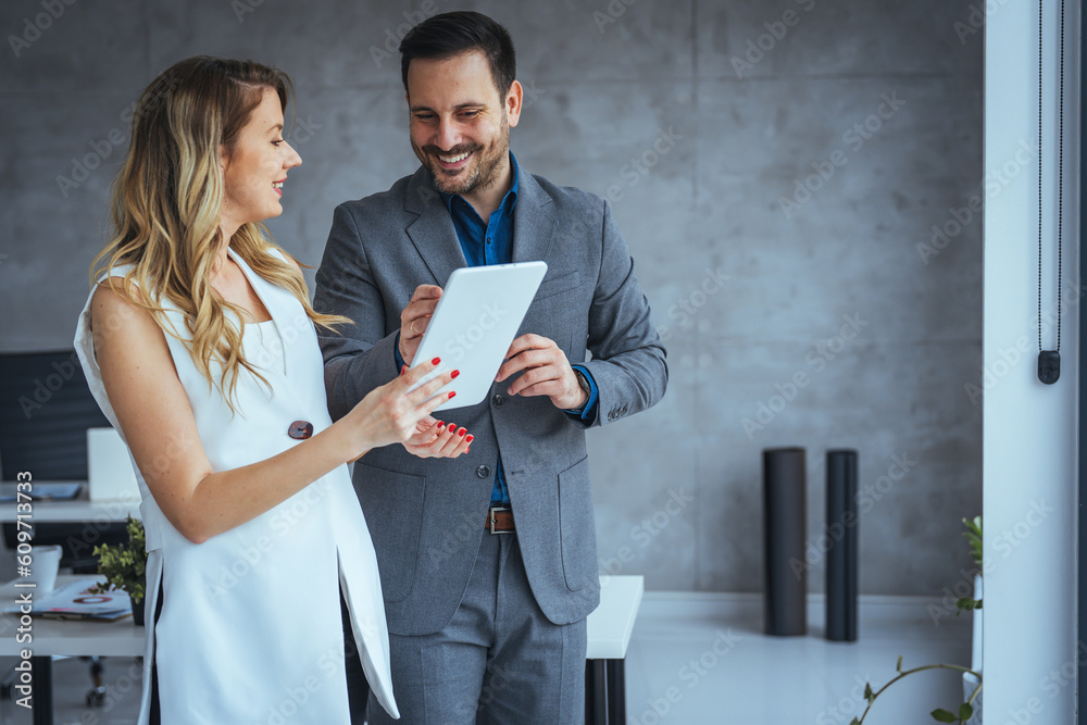 Two young businessman having a successful meeting in modern office ...