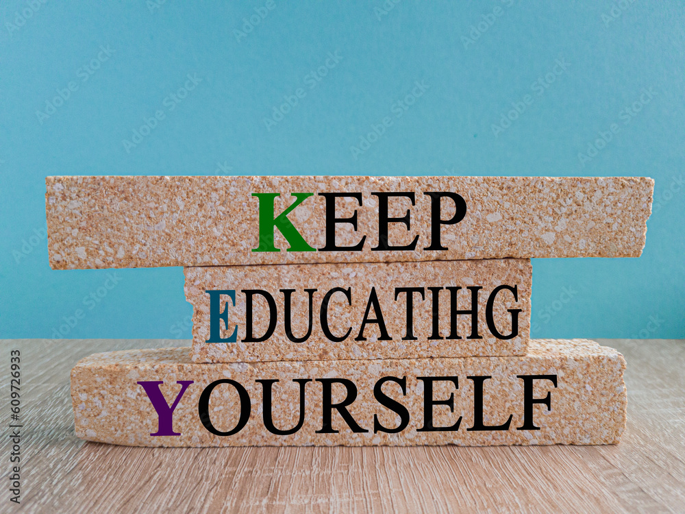 Keep educating yourself symbol. Brick blocks with words 'KEY, keep ...