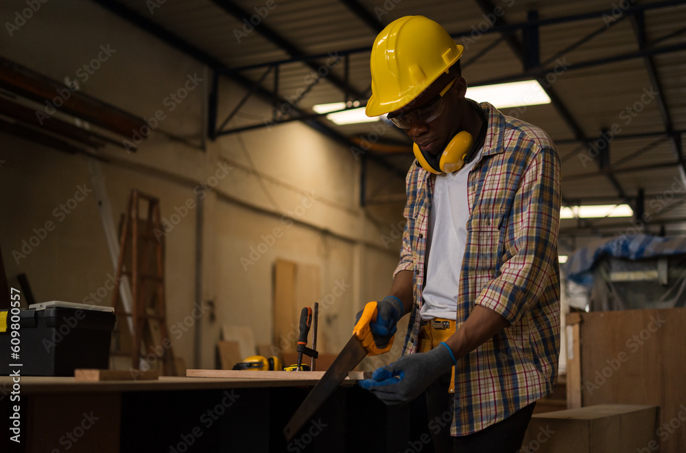 Black African Carpenter professional craftsmen wear safety gear. . He ...