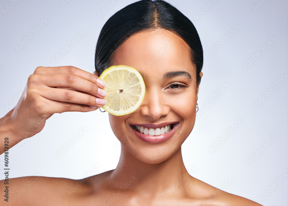 Woman, skincare and lemon in studio portrait with smile, happiness or ...