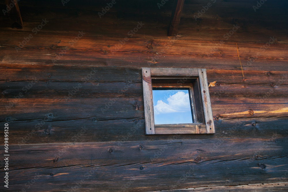Old window with sky reflection at rustic farmhouse in vintage style ...