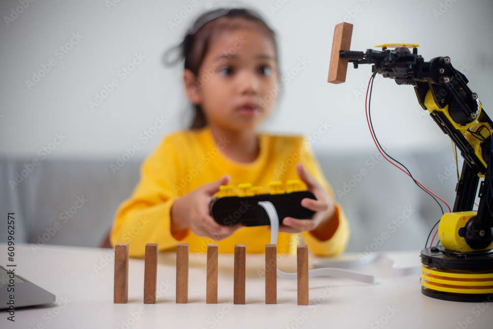 STEM education concept. Asian students learn at home by coding robot ...