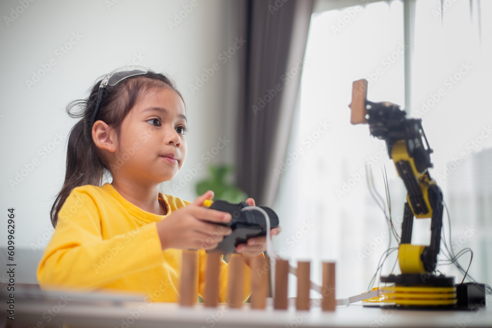 STEM education concept. Asian students learn at home by coding robot ...