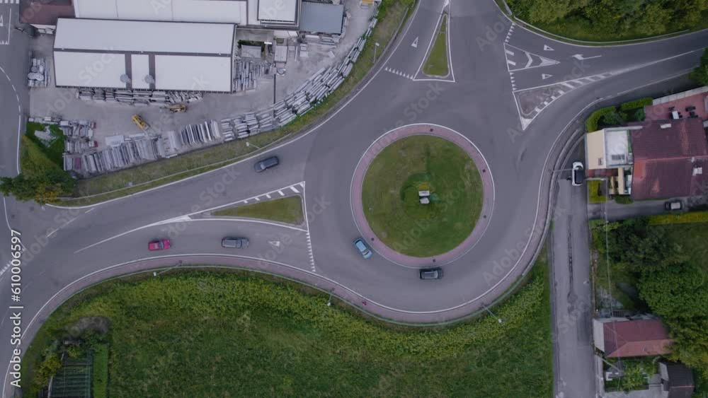Top view of a roundabout on a road with little traffic and lots of ...