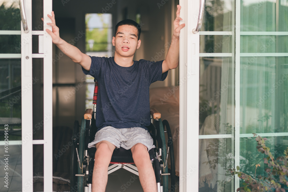 Young man with disability happy face opening the sliding door of the ...