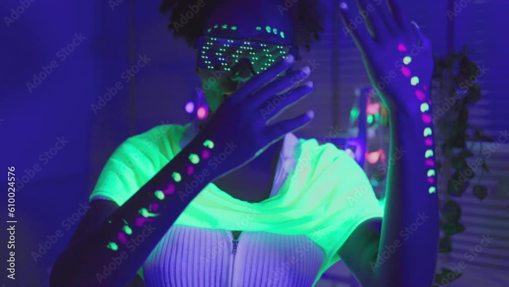 Neon asian woman dancing. Fashion model woman in neon light, portrait ...