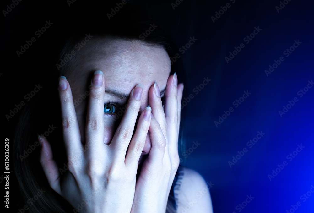 Woman is watching something scary. Close up scared girl face. Stock ...