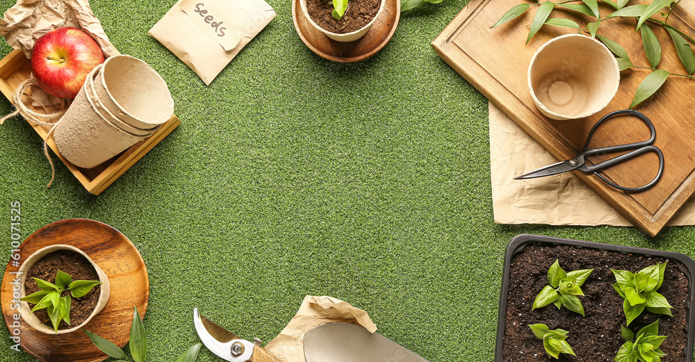 Frame made of seedlings, pack with seeds and gardening tools on green ...