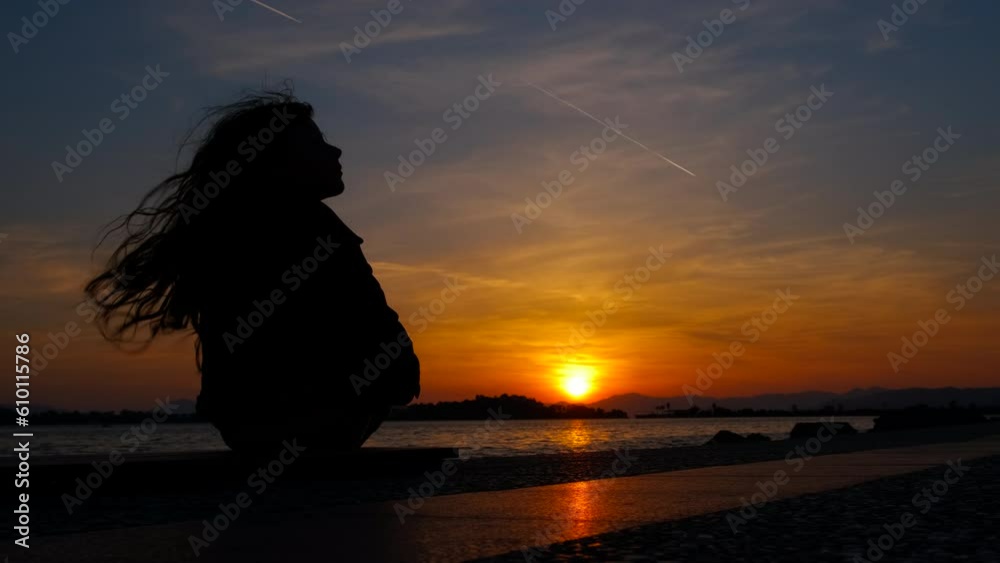 Child silhouette enjoy red shore sky. A view of little girl silhouette ...