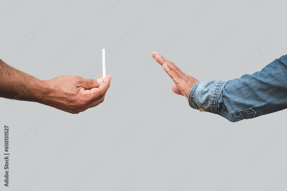 Man's hand holding a cigarette and passed to hand show signs of decline ...