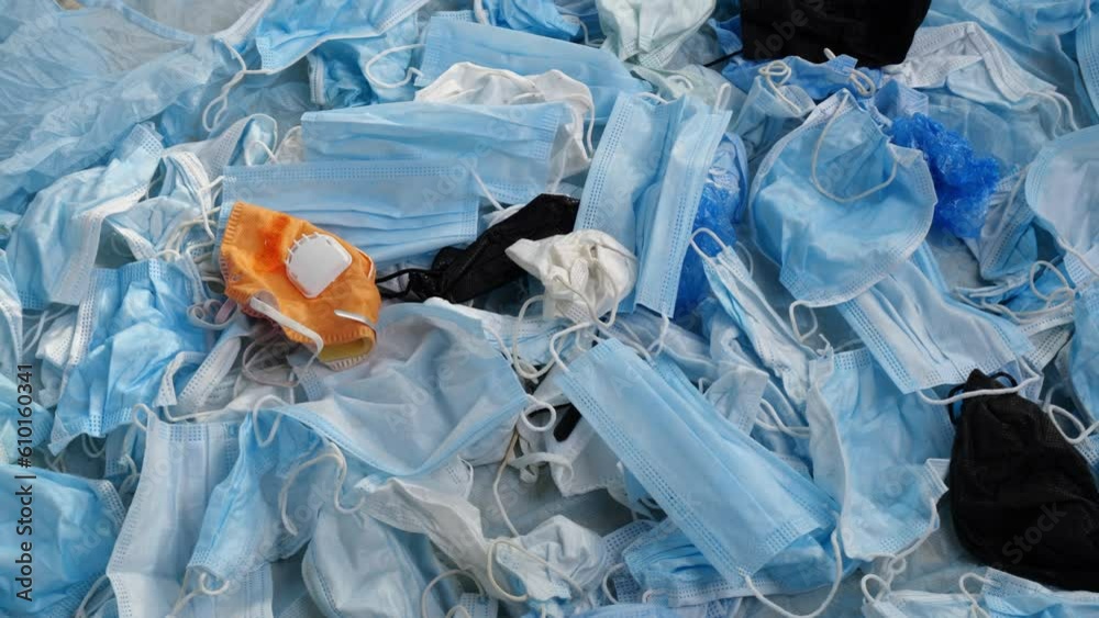 Used medical masks. Covid-19 waste. Concept of plastic pollution of the ...