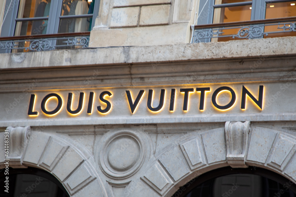 louis vuitton logo chain and sign text facade entrance store fashion ...