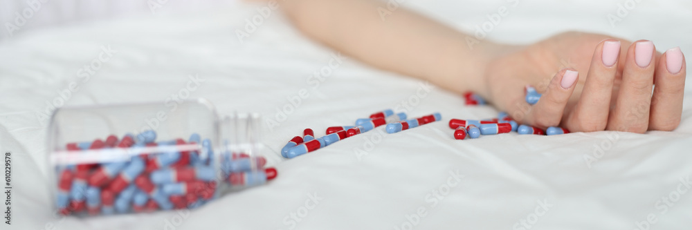Overdose pills and drug addict background. Woman sleeps unconscious ...