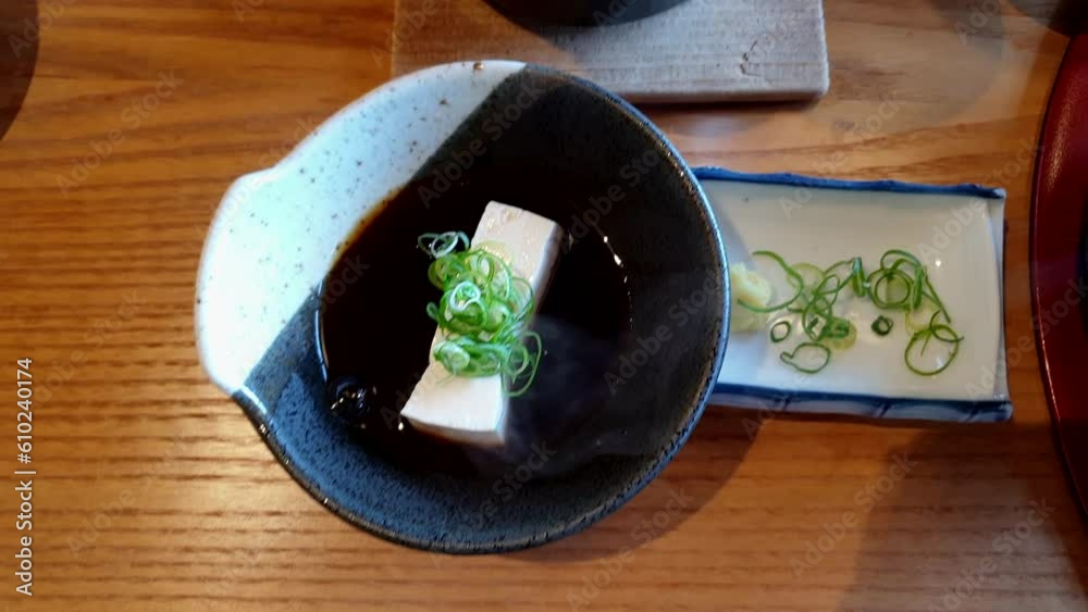 Boiling fresh homemade white tofu dip in yuzu soy sauce Kaizen ...