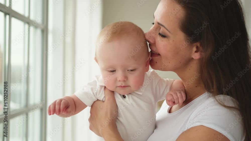 Happy family at home. Mother holding little toddler child daughter. Mom ...