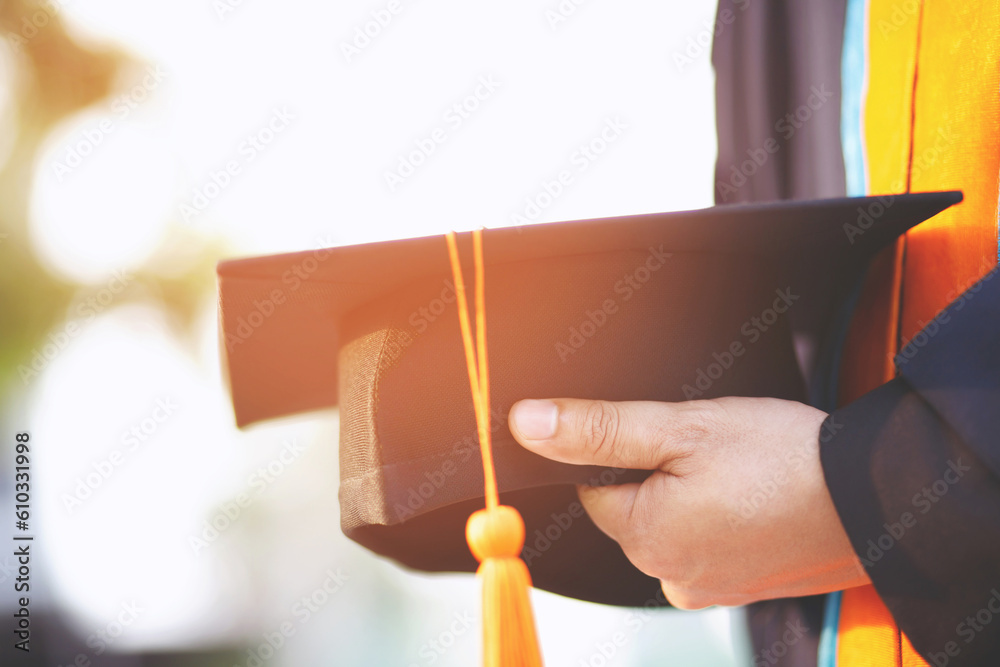 graduation,Student hold hats in hand during commencement success ...