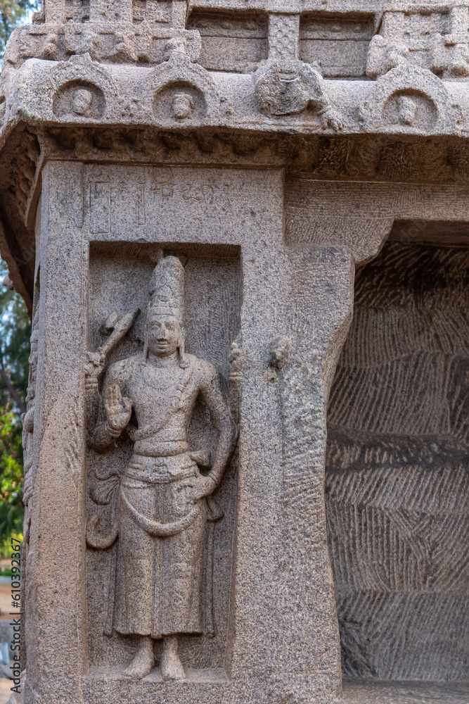 Stone wall carvings of Hindu God bas relief sculpture in rock cut ...