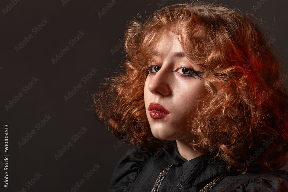 Sad cute girl in a gothic image in a dark room Stock Photo | Adobe Stock