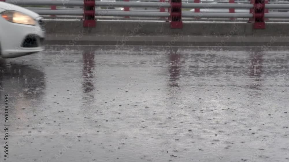 Car tires on flooded city street during heavy rain, very heavy rain ...