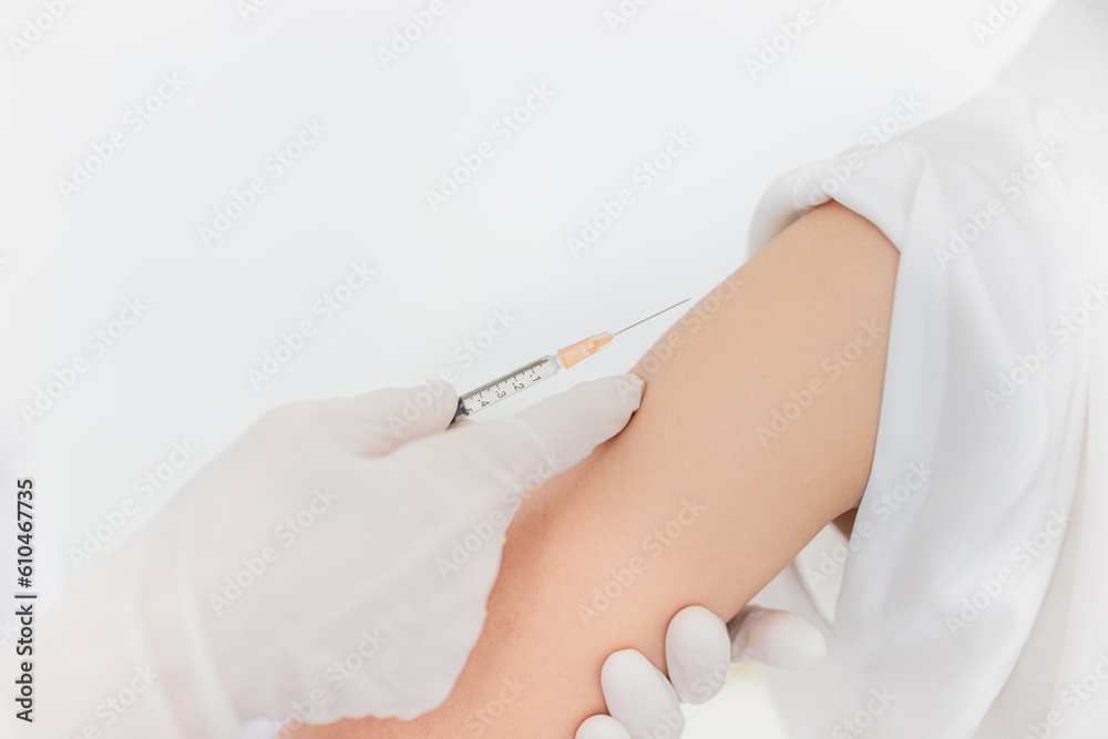 doctor inject vaccine to woman, Deltoid muscle injection technique ...