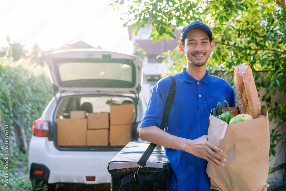 Parcel delivery staff deliver products to customers at the front of the ...