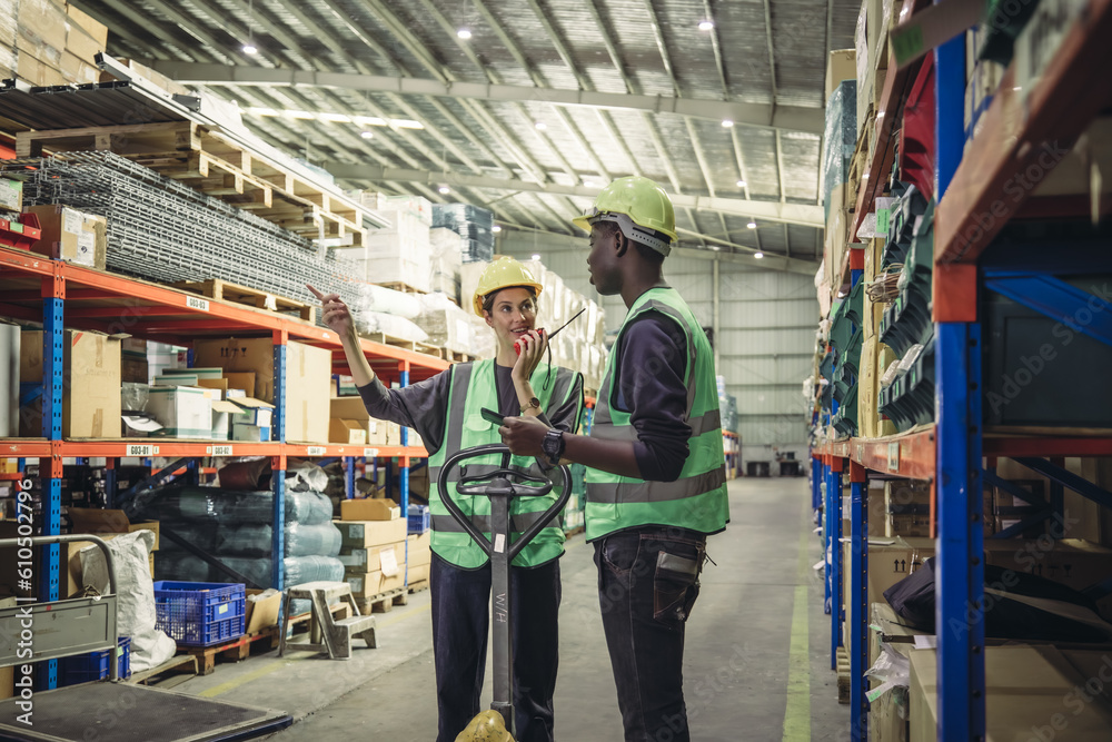 Warehouse supervisor uses two way radio for seamless communication and ...