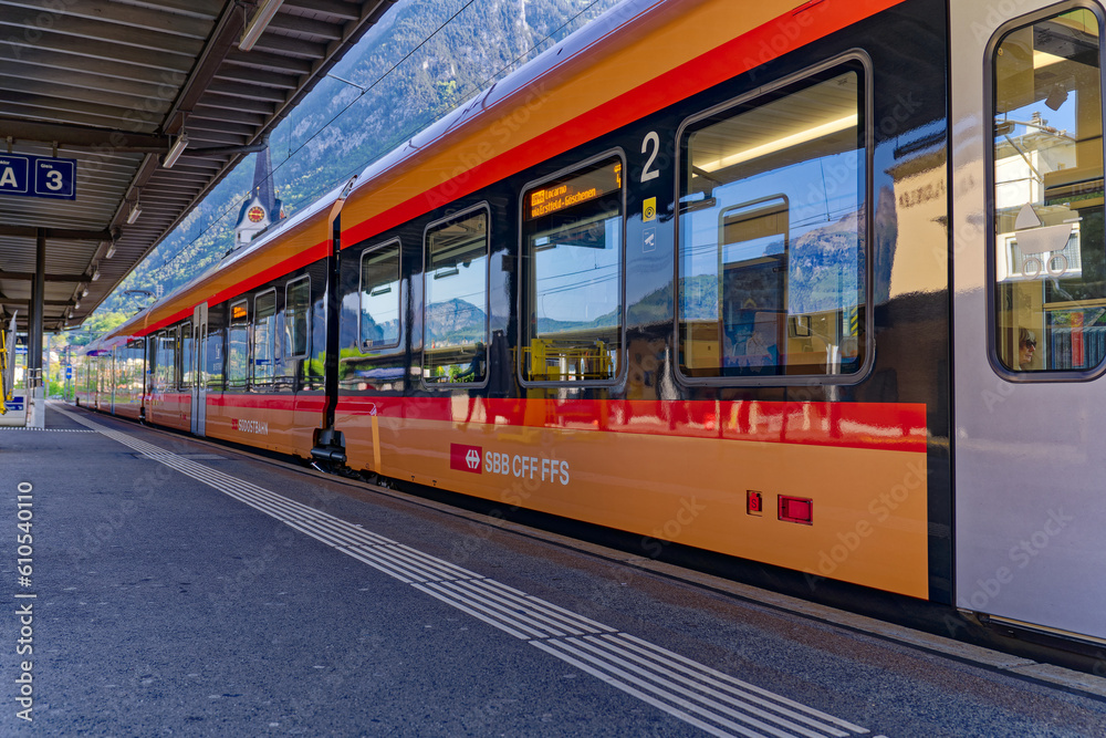 Golden SOB train named Treno Gottardo at railway station of Swiss ...