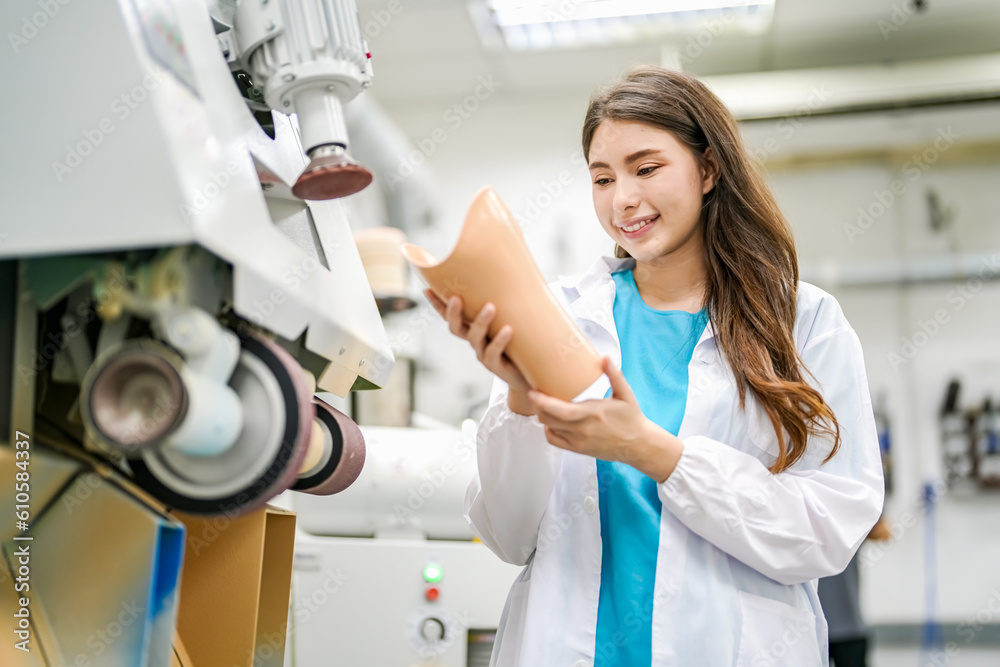 Portrait of pretty female artistcian or technician making an artificial ...