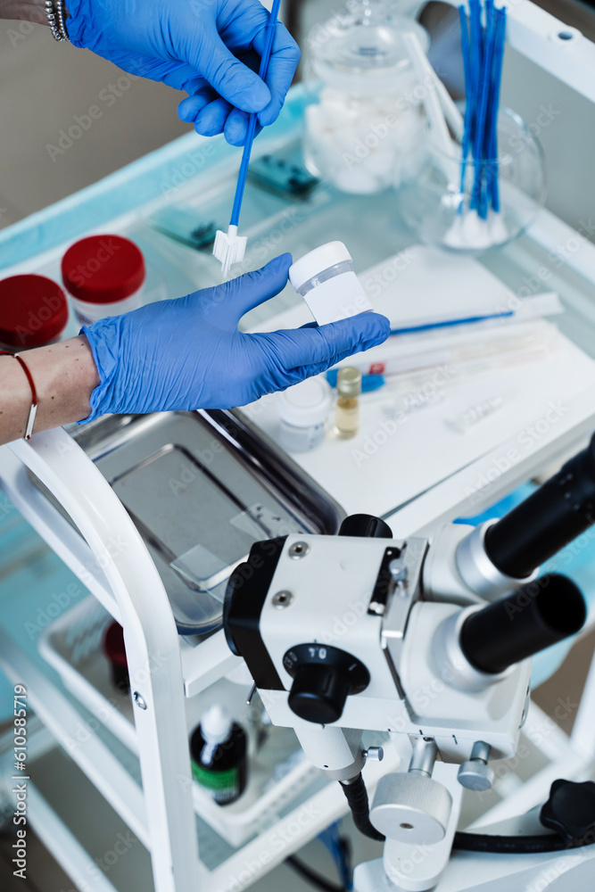 Gynecological cytology Pap smear test and cytobrush in hands of ...