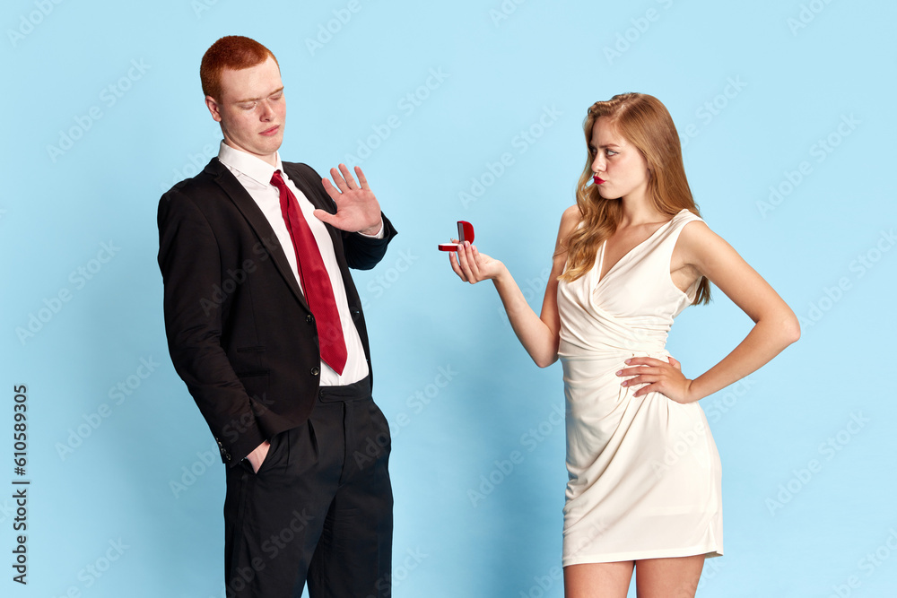 Beautiful young girl in white dress proposing to her boyfriend to get ...