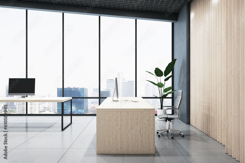 Stylish workspace table side view in coworking office with modern ...
