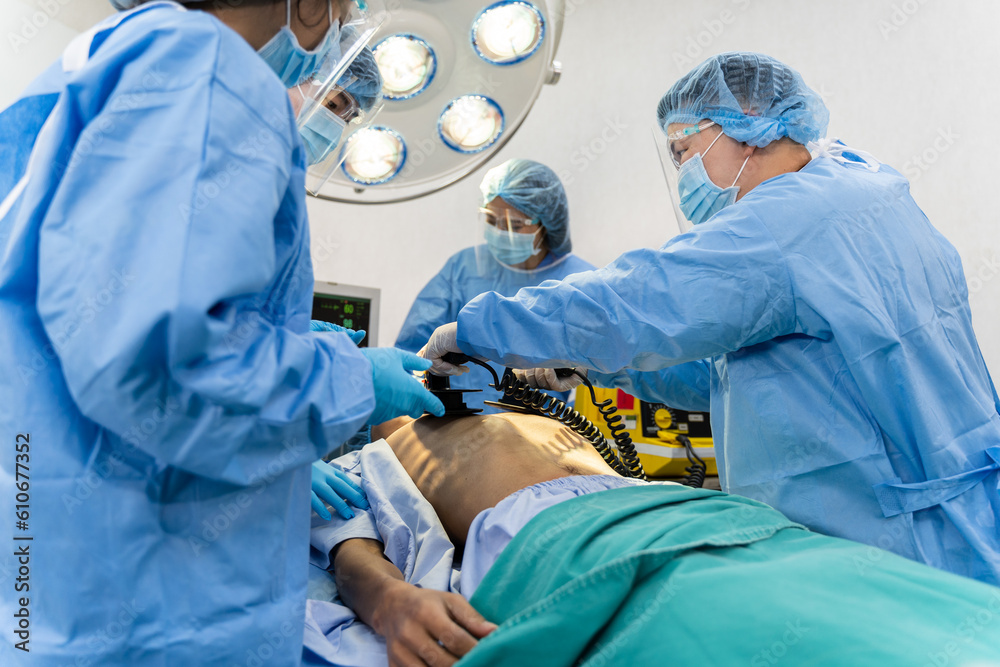 Medical team in Surgical gown help patient to making CPR Cardio ...
