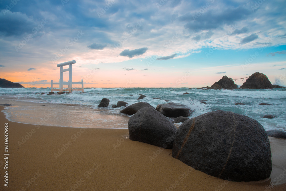 Photo & Art Print The sun setting on the horizon of beach where a white ...