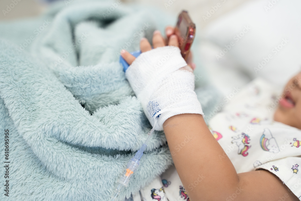 child is receiving medication through intravenous fluid therapy in ...