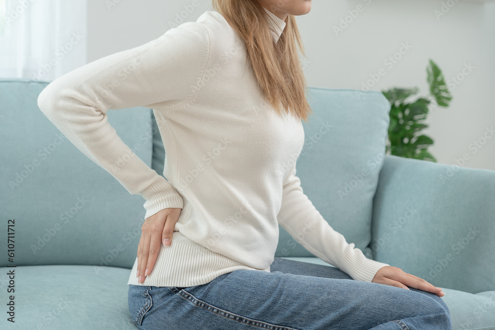 Asia beautiful woman holding her lower back while and suffer from ...