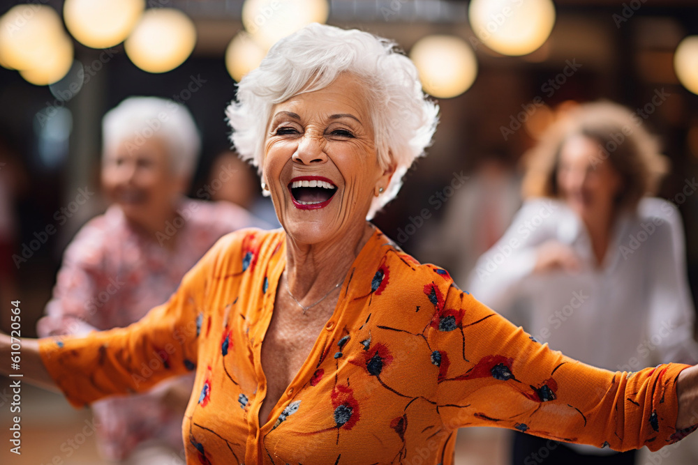 A senior woman enthusiastically participating in a lively dance class ...