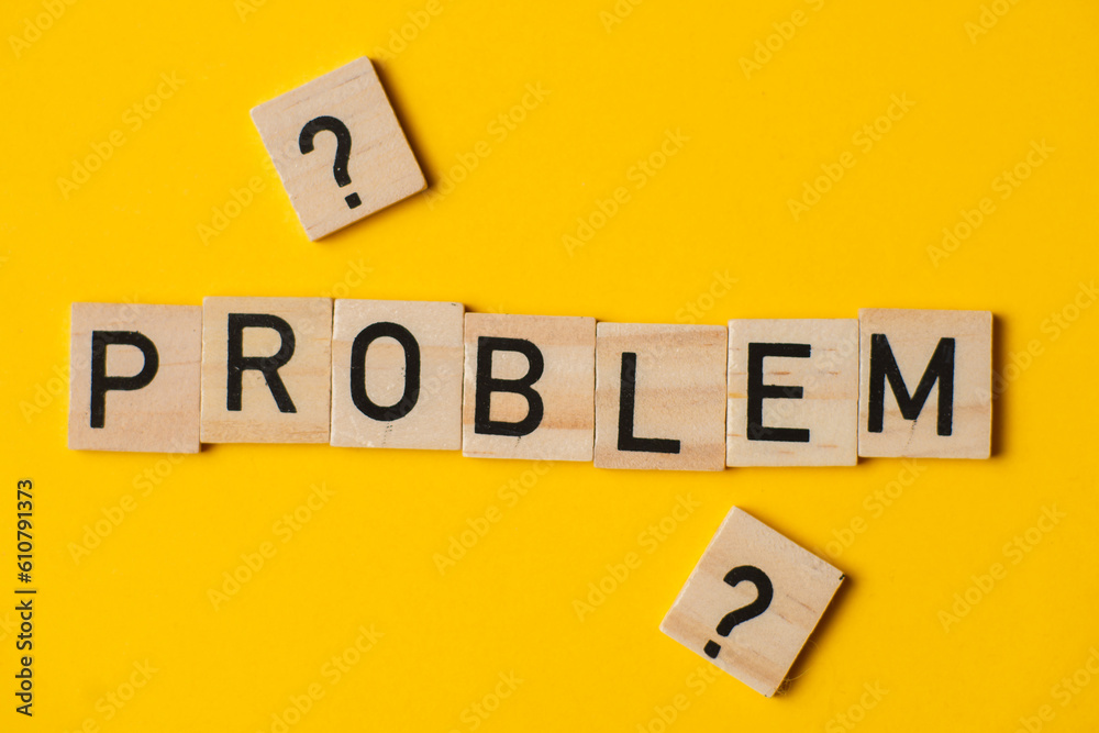 the word problem on a yellow background with question marks. The ...