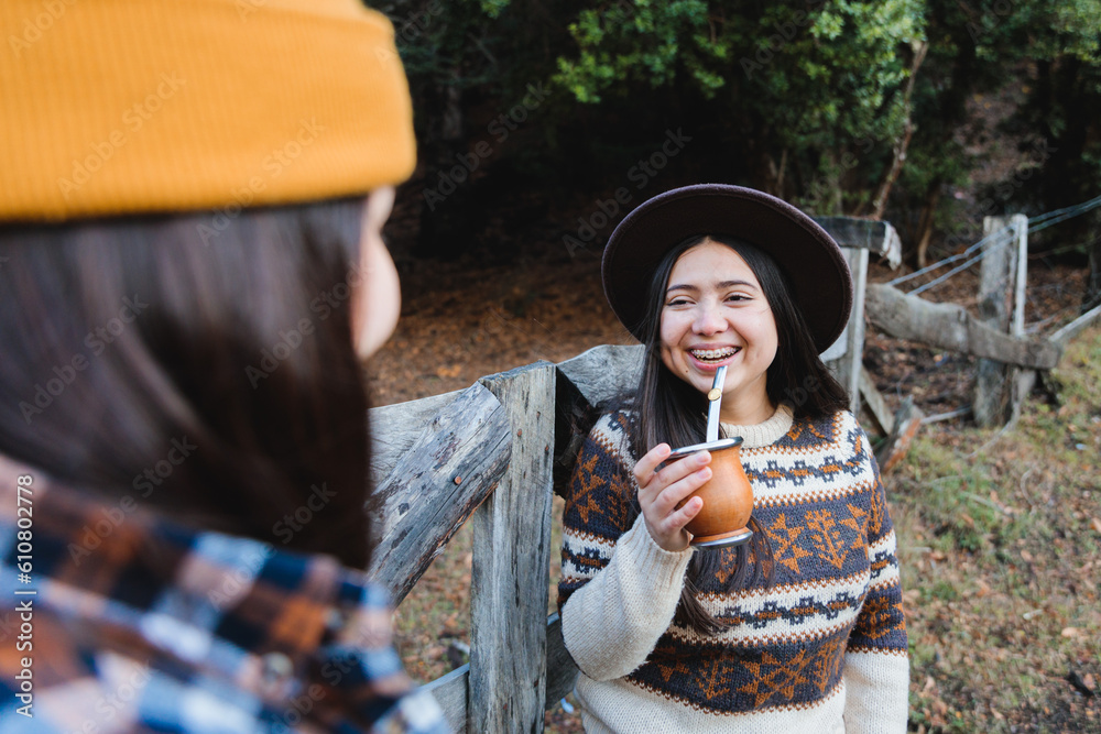 Two Cheerful Young Women Delighting in Yerba Mate Ritual at Countryside ...