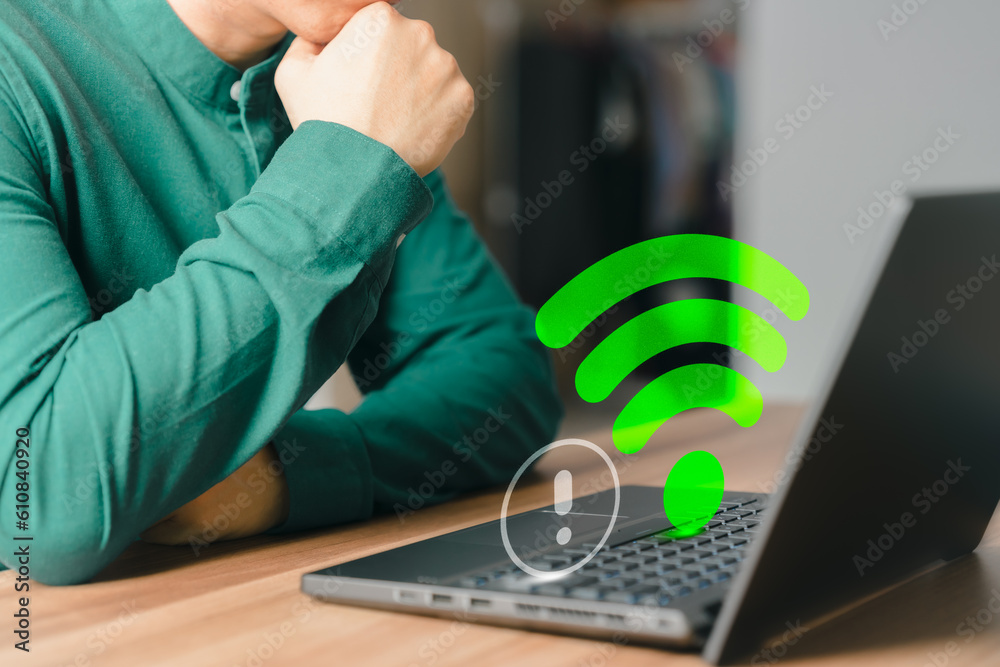 Adult Man Using A Computer Laptop To Connect To Wifi In His Home But