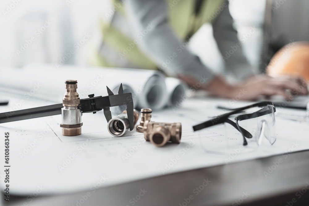 Engineering working with drawings inspection on the office desk safety ...