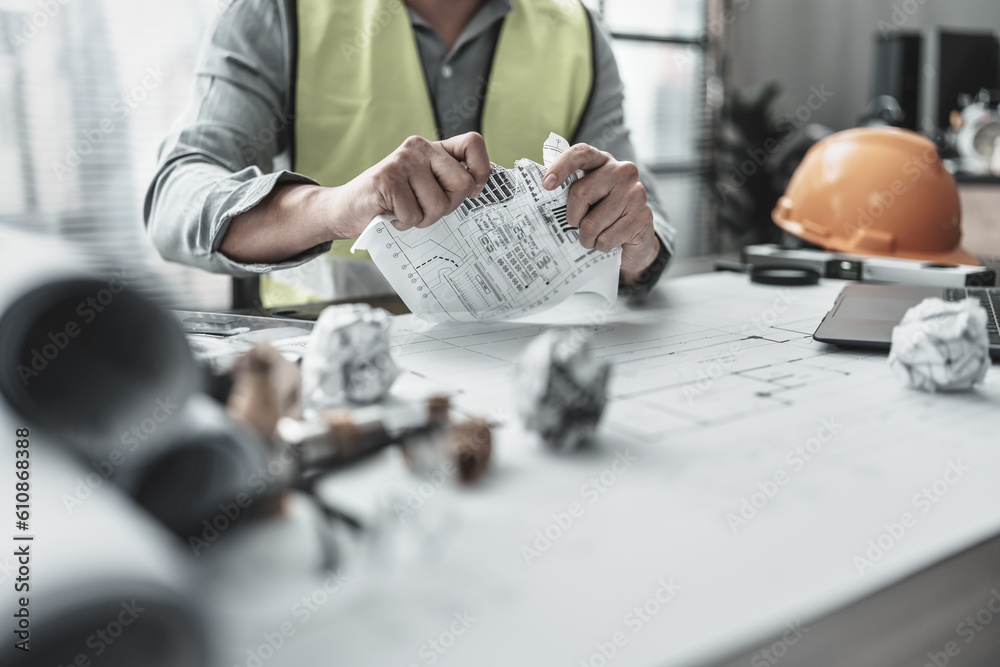 The architect made a mistake in designing the plan and torn paper ...