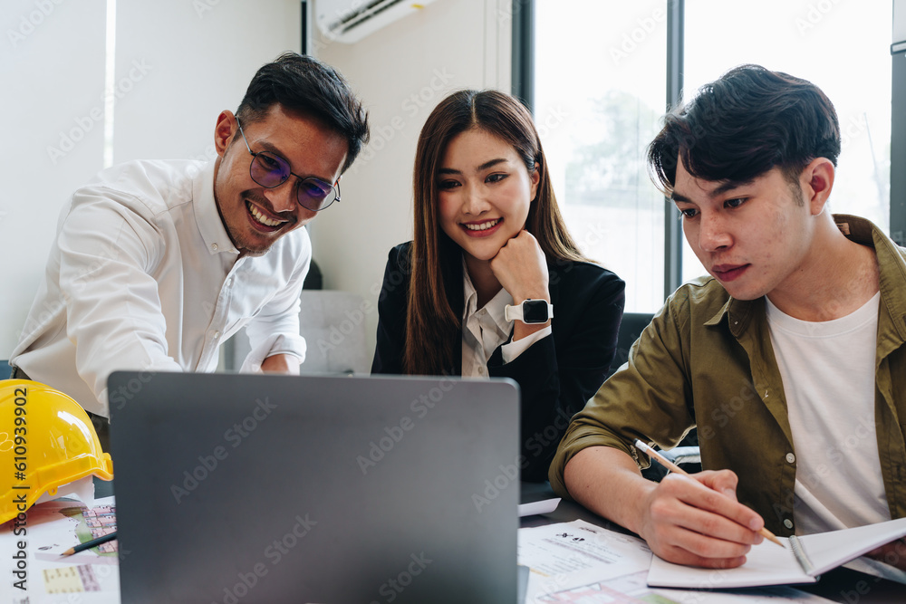 multi ethnic engineer brainstorming and measuring for cost estimating ...