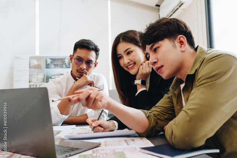 multi ethnic engineer brainstorming and measuring for cost estimating ...