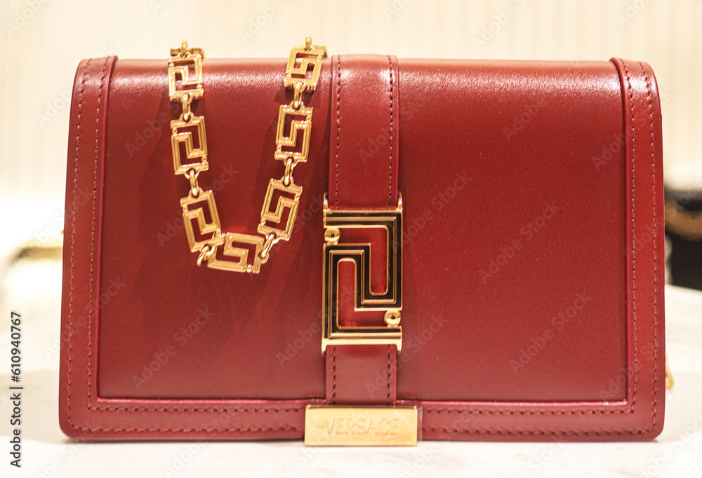 red leather purse, golden chain and logo by Versace.Milan - Italy,08 ...