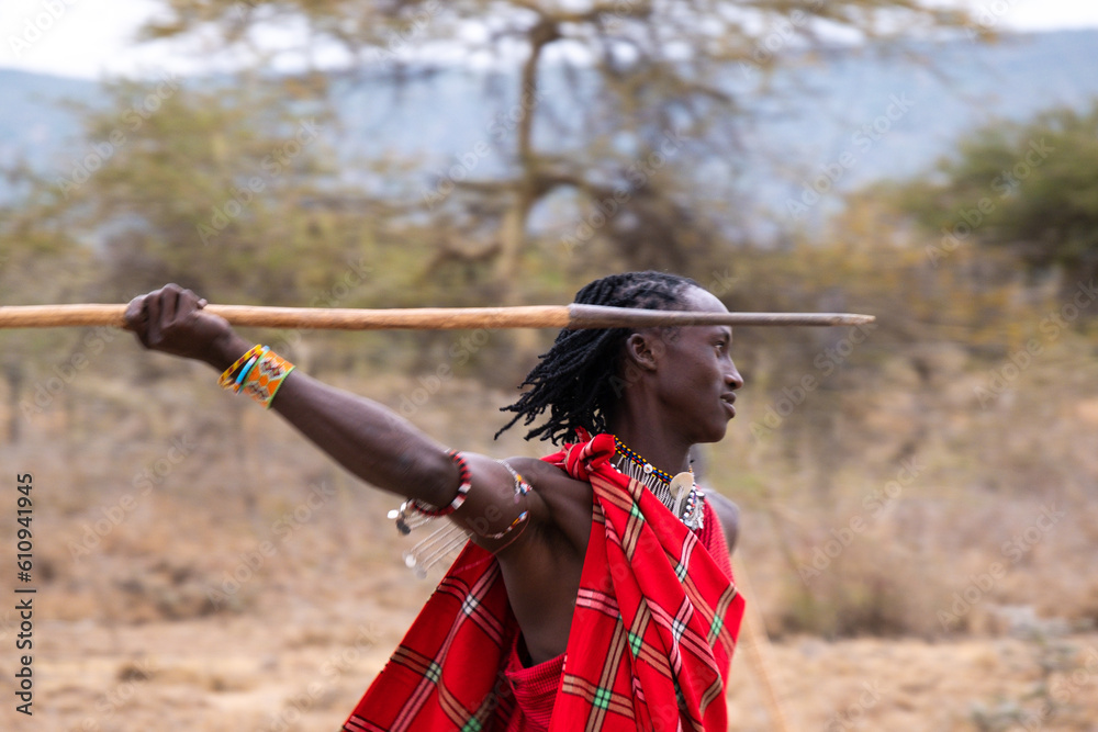 Maasai tribesman throwing a spear and hunting Stock-Foto | Adobe Stock
