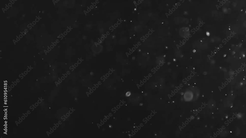 Vidéo Stock Small dust particles moving in slow motion on black ...