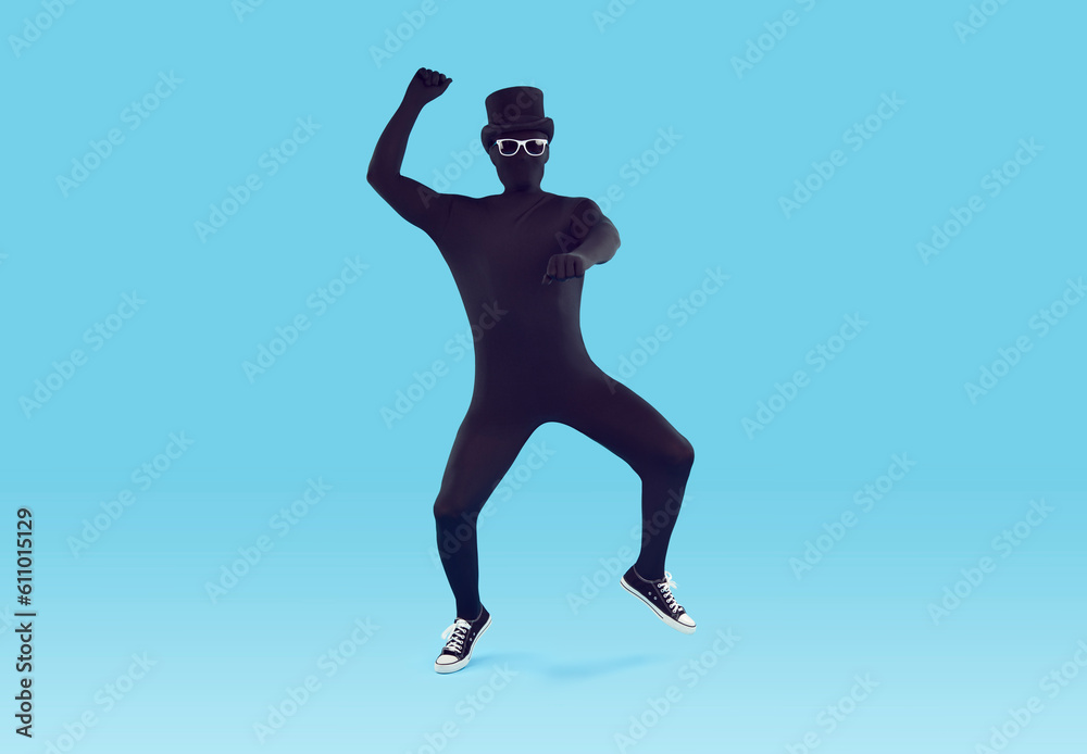 Mysterious faceless man dressed in black bodysuit dancing. Full length ...