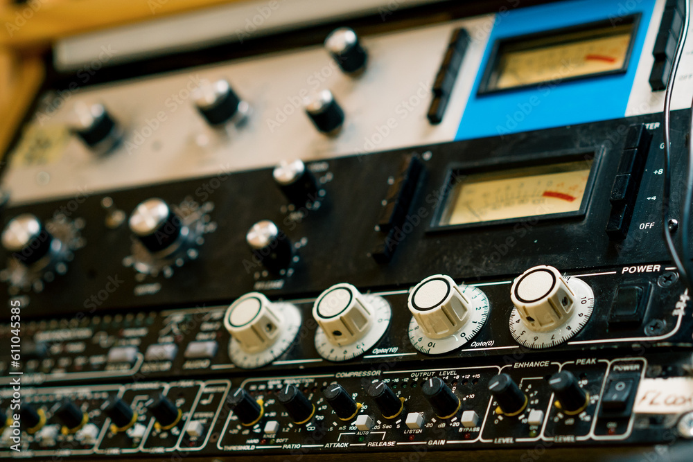 old displays of professional analog volume meters in a recording studio ...