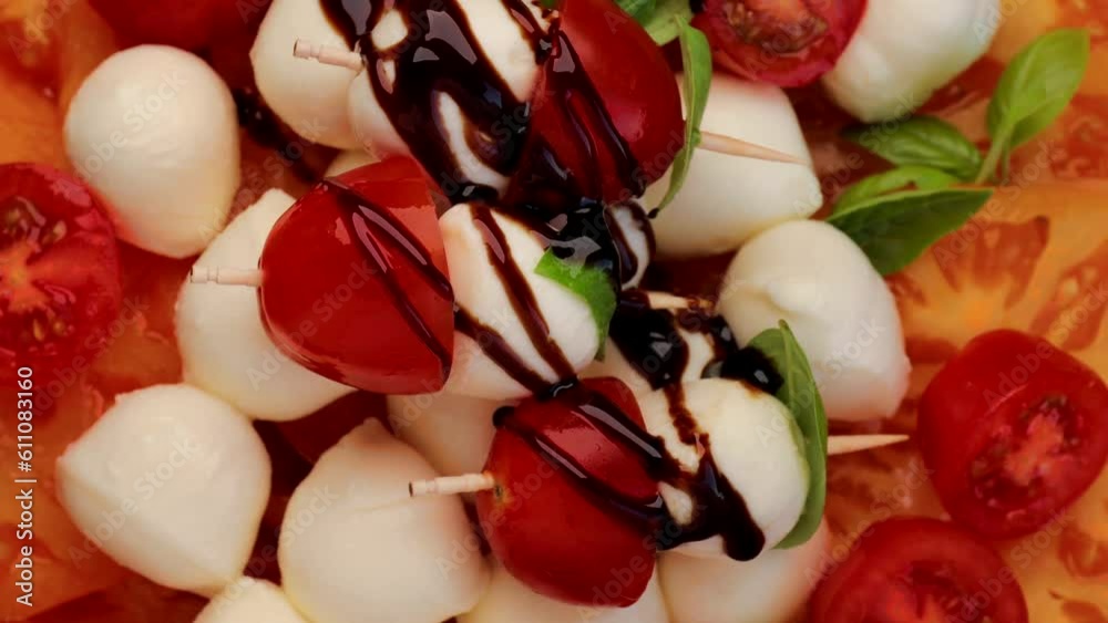 Caprese canapes , rotation in circle. Mozzarella cheese balls and red ...