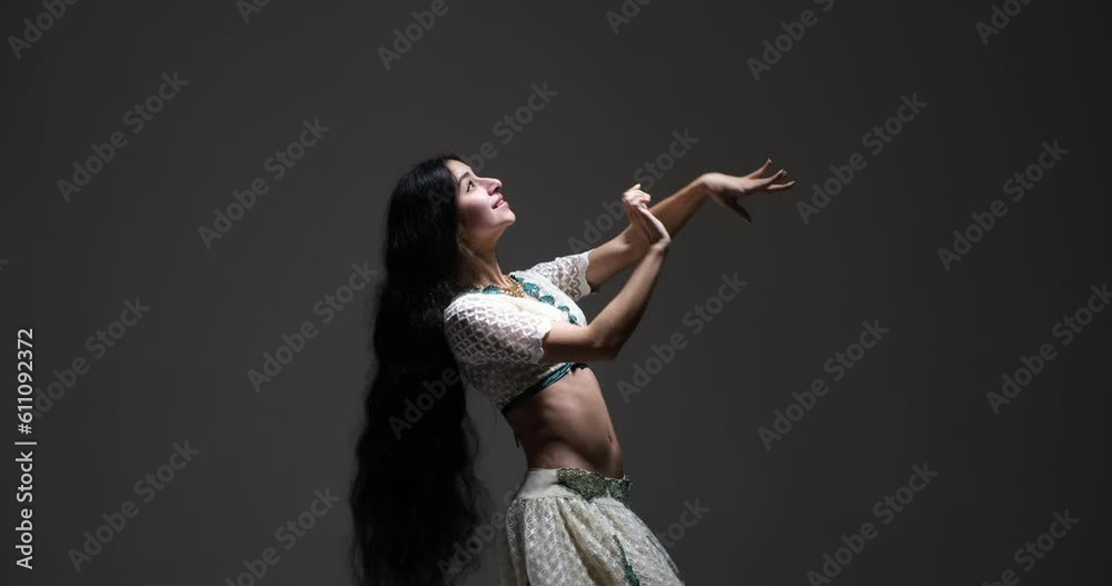 Watch this talented Indian dancer perform a classical dance in a white ...